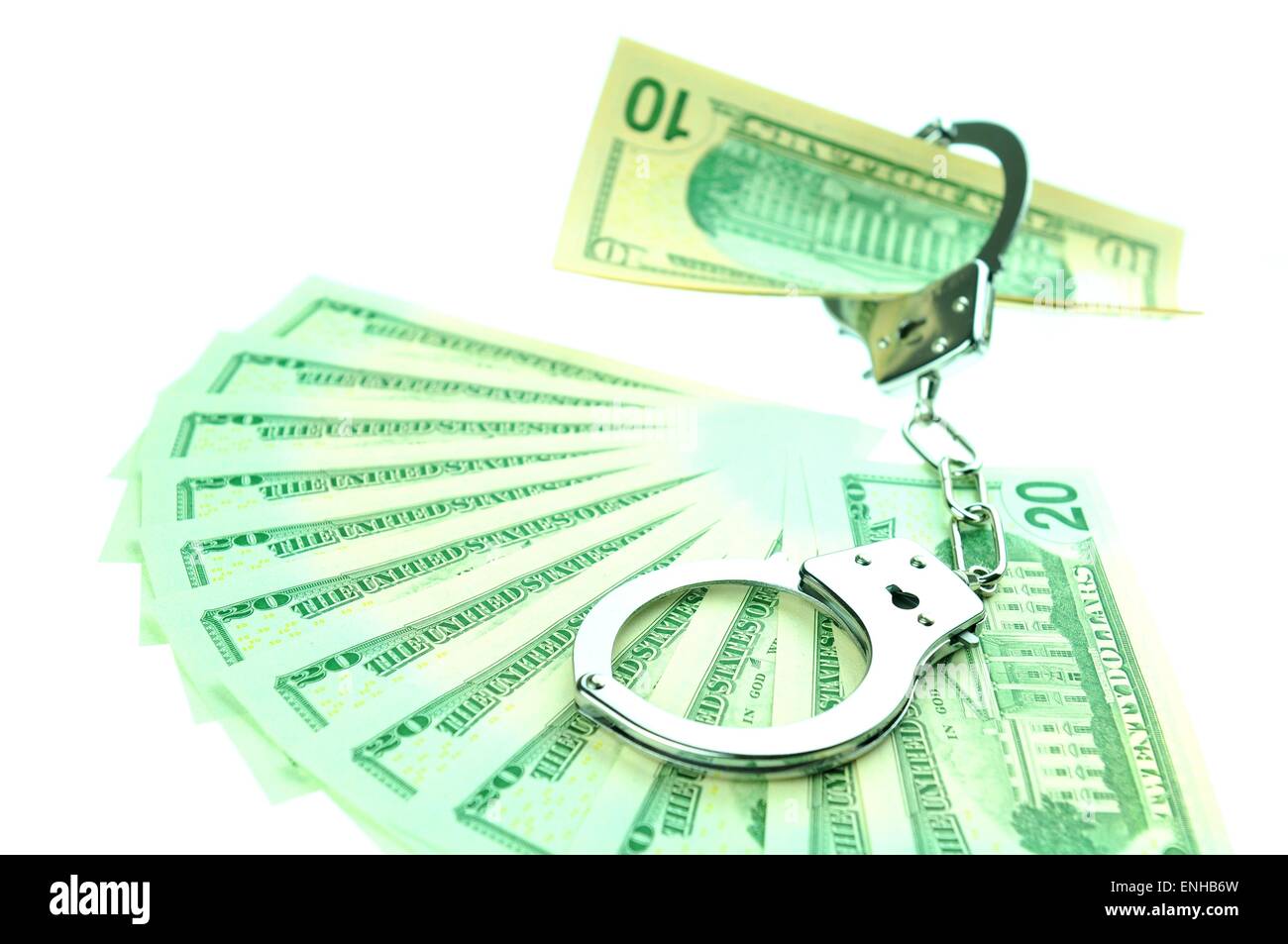 Financial crime concept with handcuffs on money background Stock Photo ...
