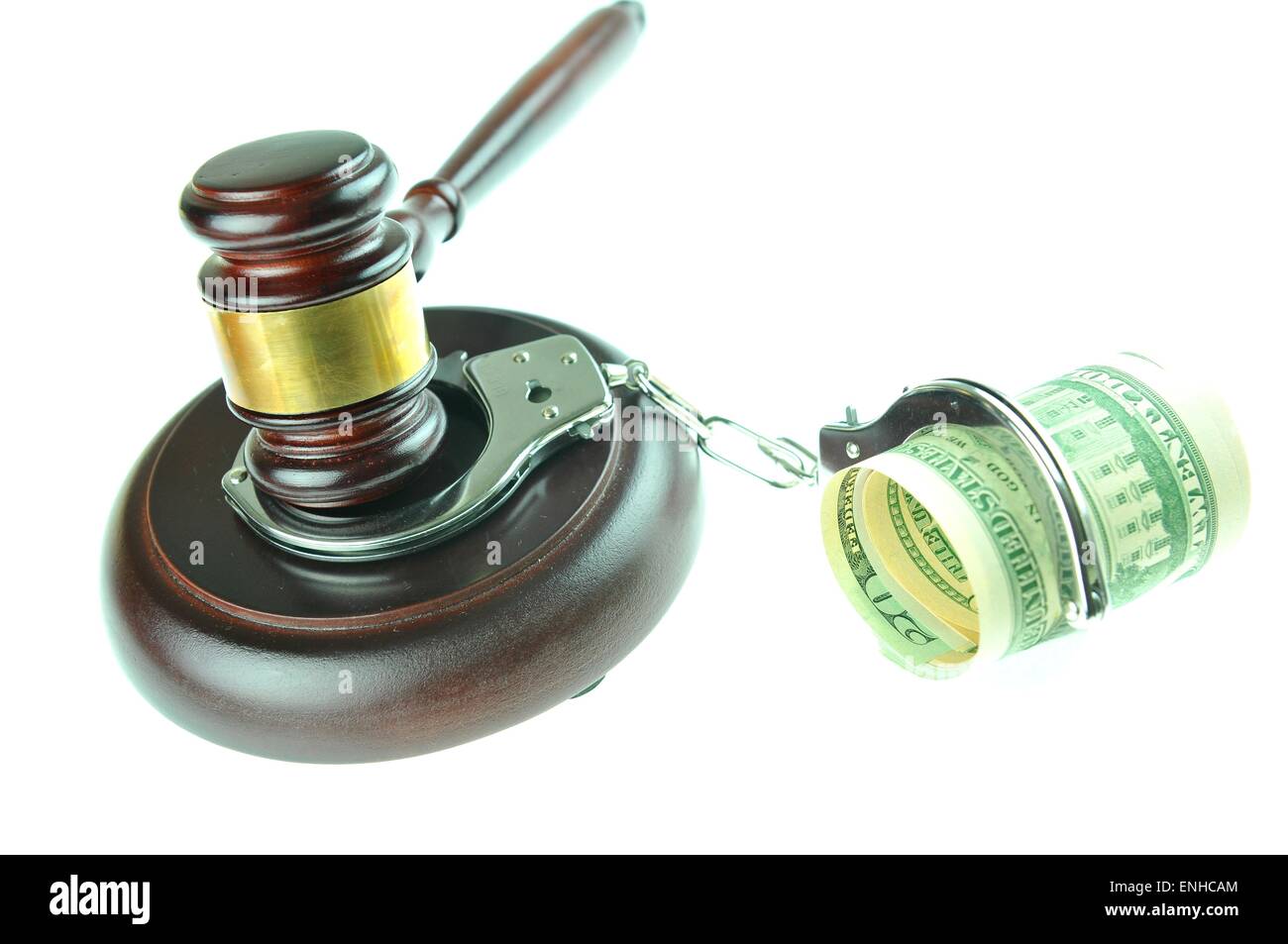 Bribe concept with gavel and handcuffs isolated against white ...