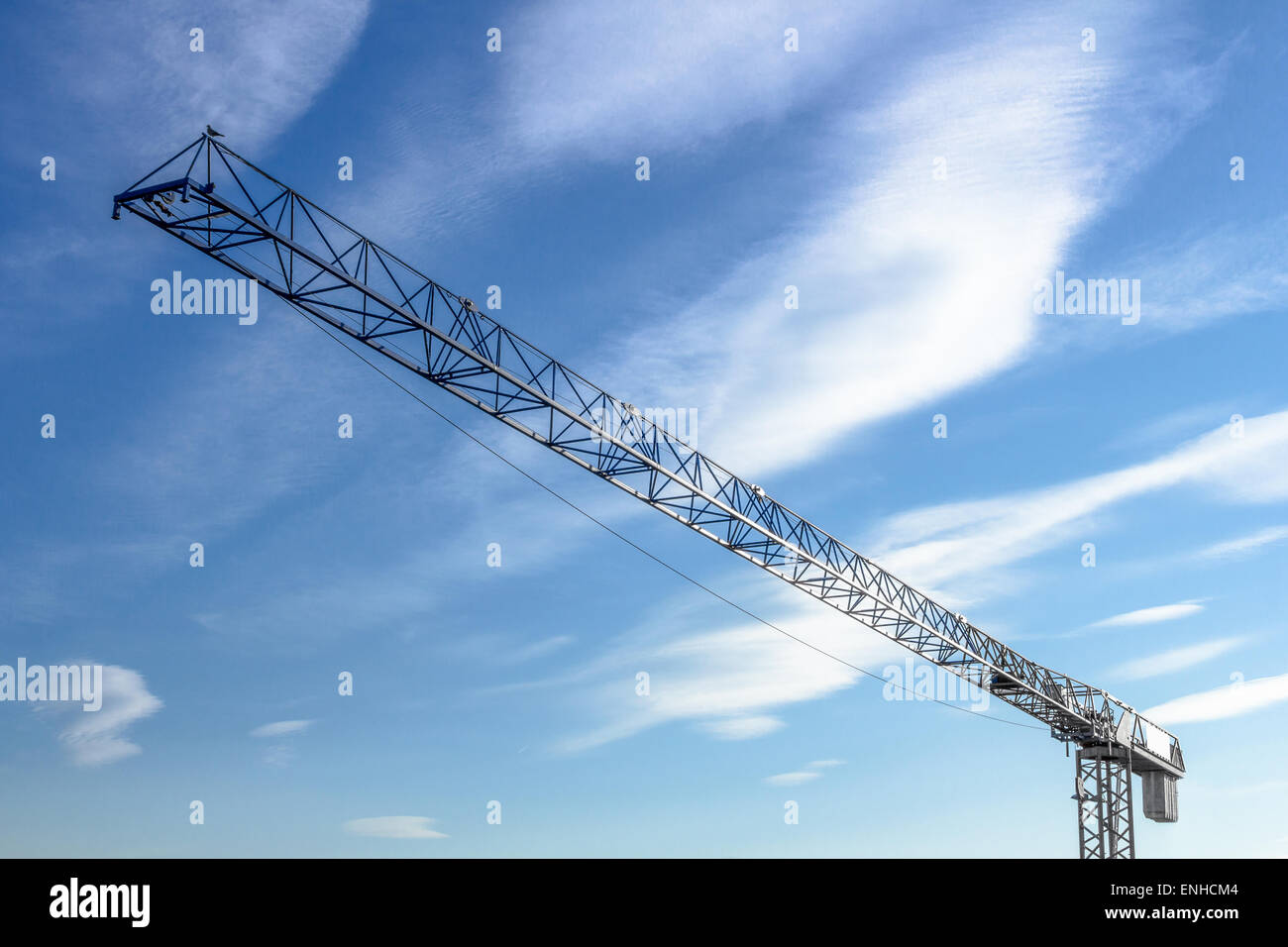 Bottom view of a large crane, with blue sky in the background Stock ...