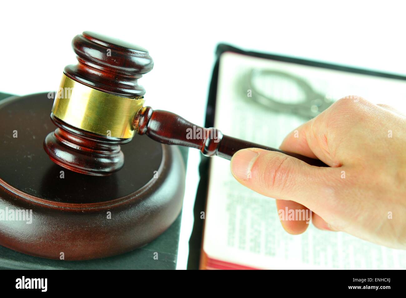 Judge holding a gavel Stock Photo - Alamy