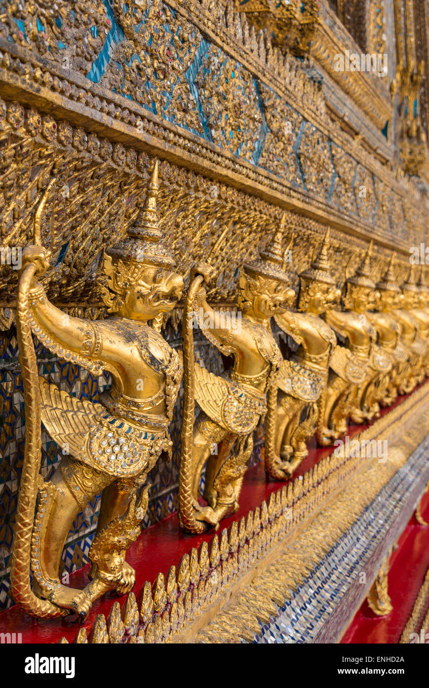 Golden statues, Garuda with Nagas, demons, guardians, Wat Phra Kaeo ...