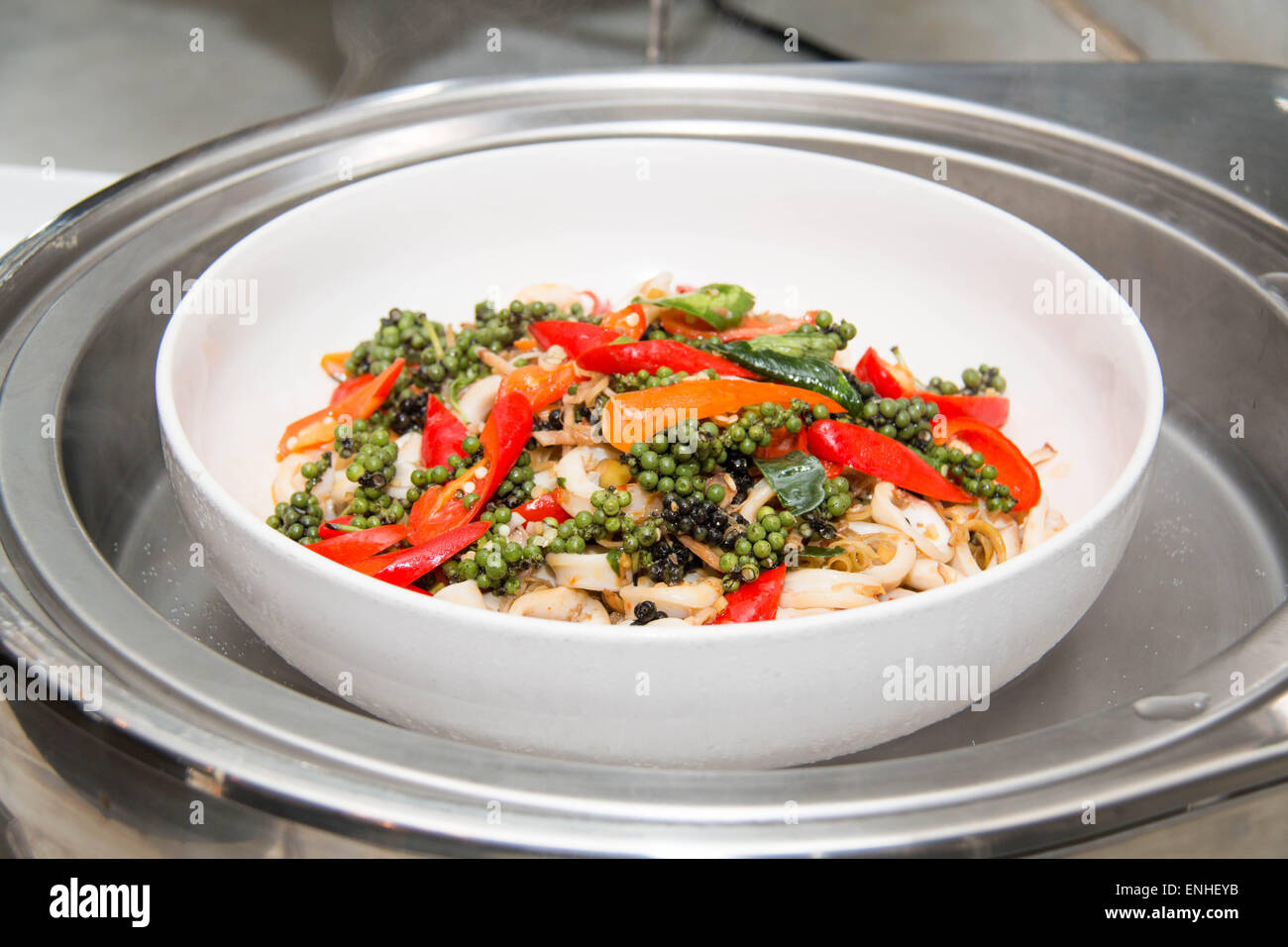 Stir basil sea squid and thai food Stock Photo - Alamy