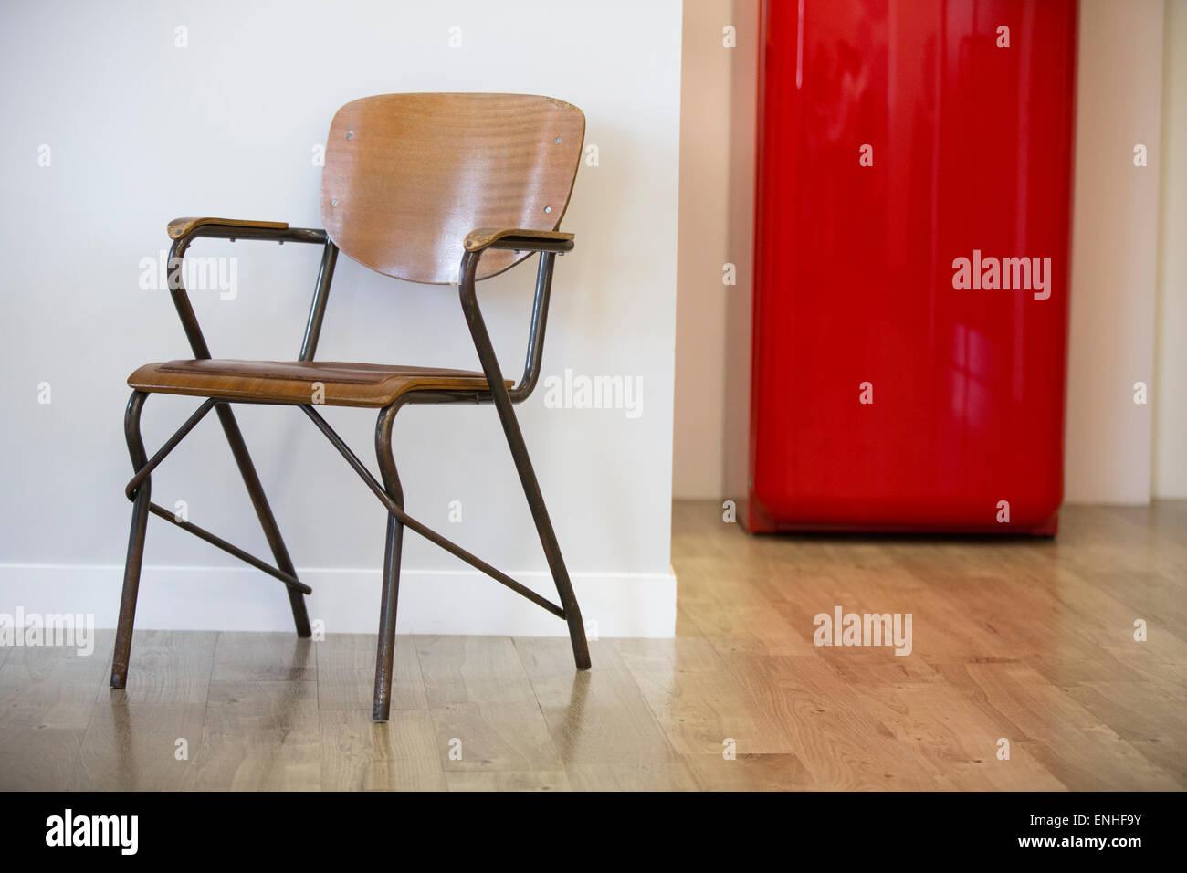 chair and red fridge in london office Stock Photo - Alamy