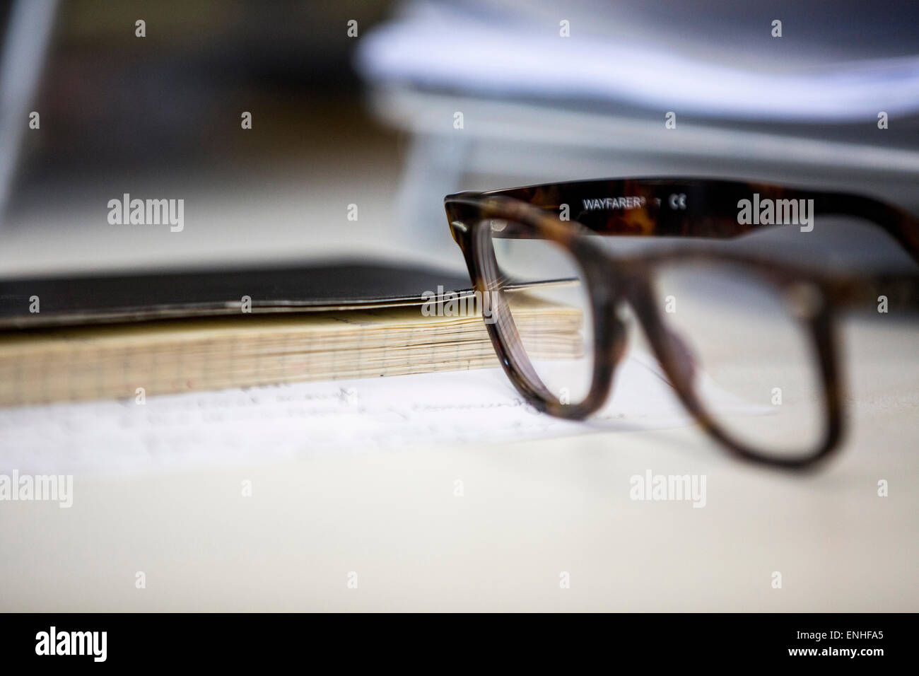 glasses on office desk Stock Photo - Alamy