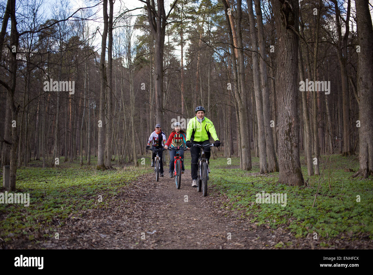 Young people riding bikes Stock Photo - Alamy