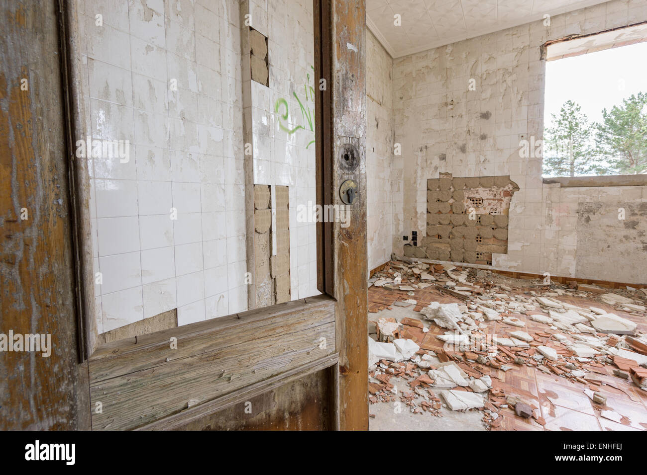 Abandoned and ruined room with broken door Stock Photo - Alamy