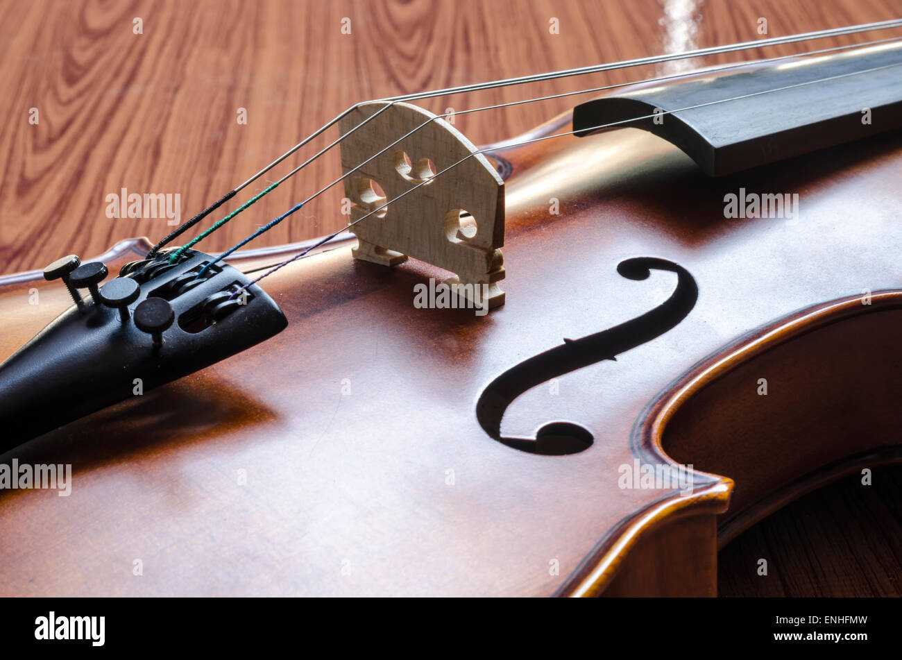 string instrument "violin" on wood background Stock Photo - Alamy