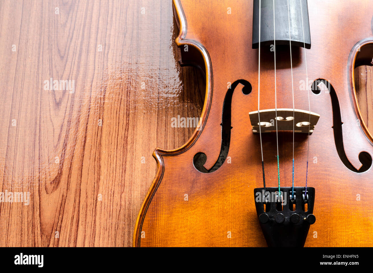 string instrument "violin" on wood background Stock Photo - Alamy