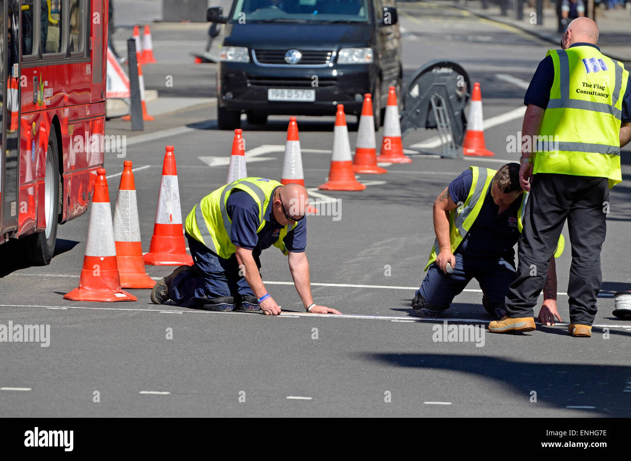 London, England, UK. Workmen marking out roadworks in Whitehall Stock ...