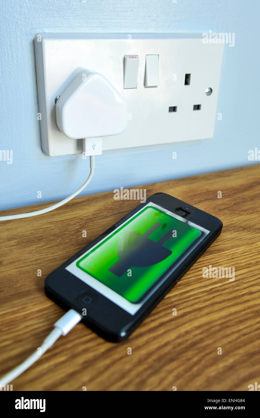 Iphone charging in a socket hi-res stock photography and images - Alamy