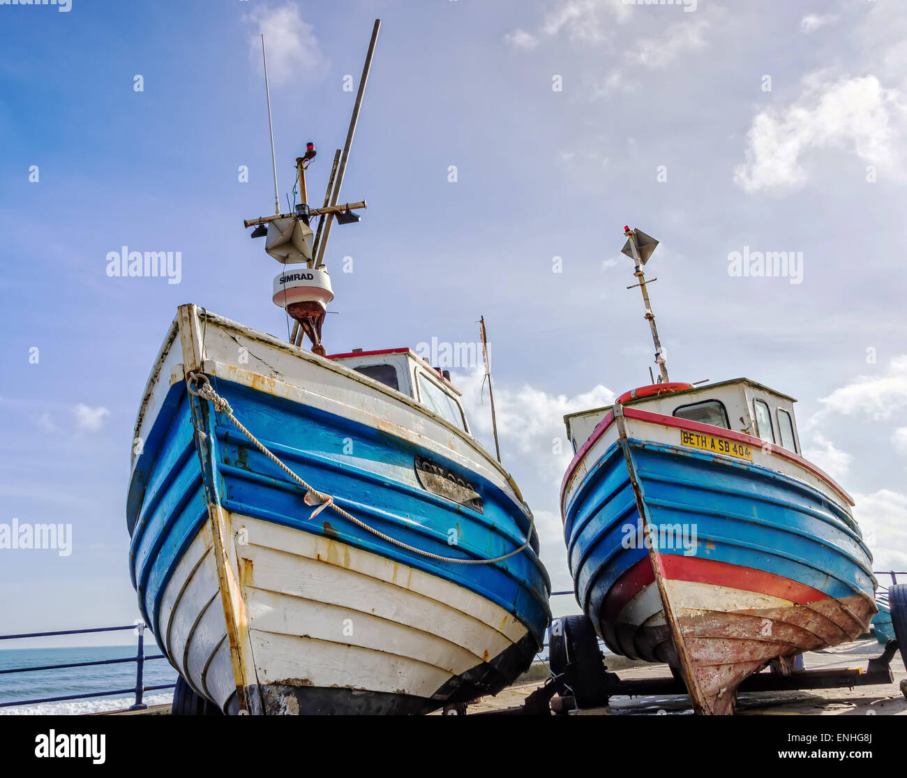 Two fishing boats out of the water and ready to launch Stock Photo - Alamy
