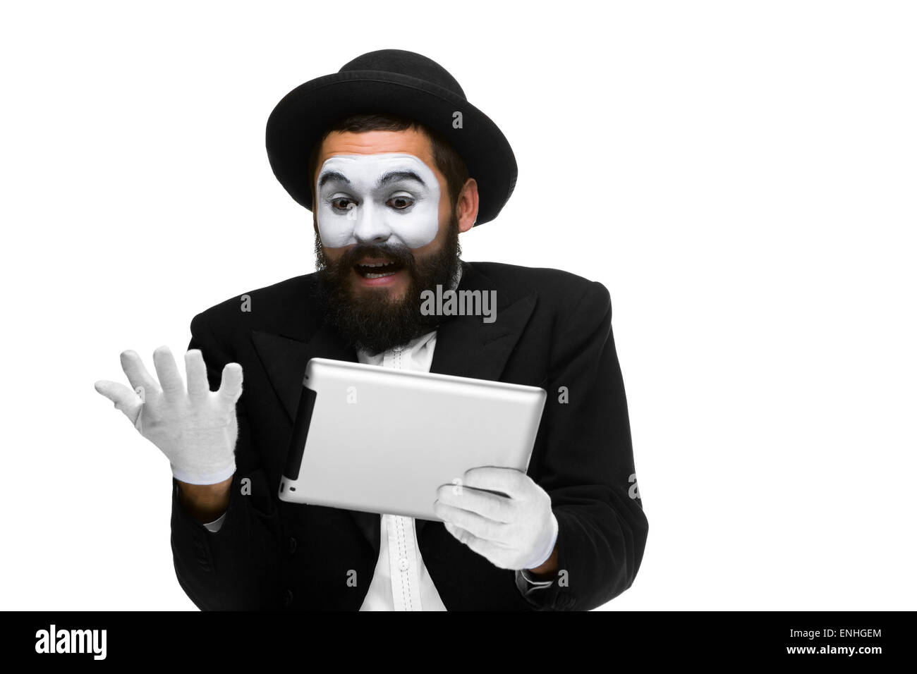 Man with a face mime working on laptop Stock Photo - Alamy