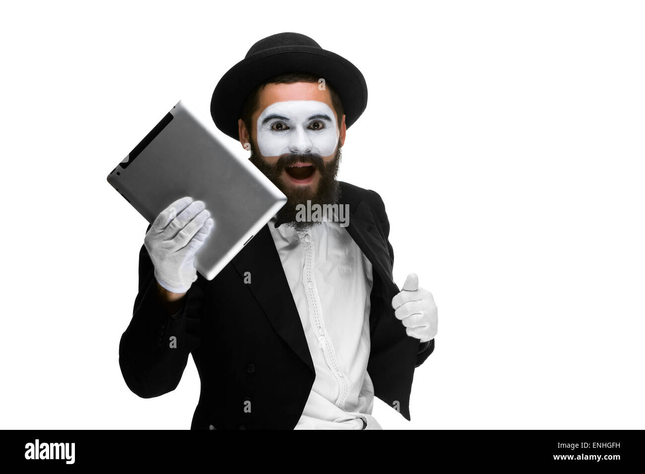 Man with face mime working a laptop isolated on white background Stock ...