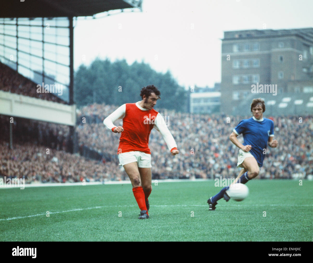 Arsenal footballer Ray Kennedy in action against Leicester City watched ...