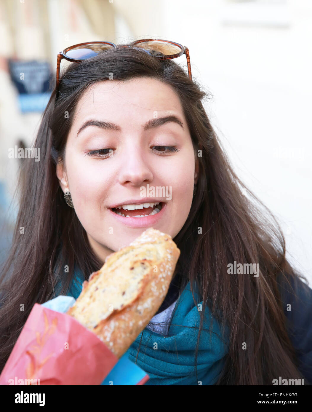 Beautiful girl that eating baguette Stock Photo - Alamy
