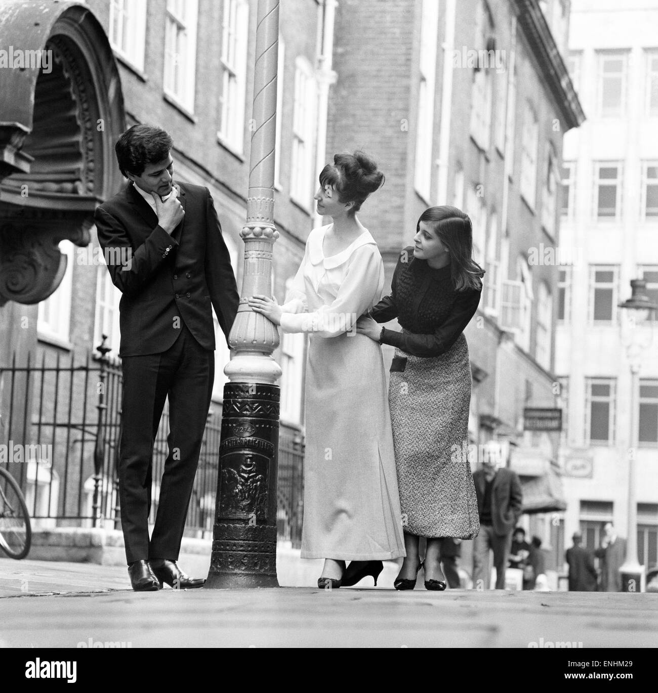 Eden Kane, British pop singer, pictured with two models showing off the ...