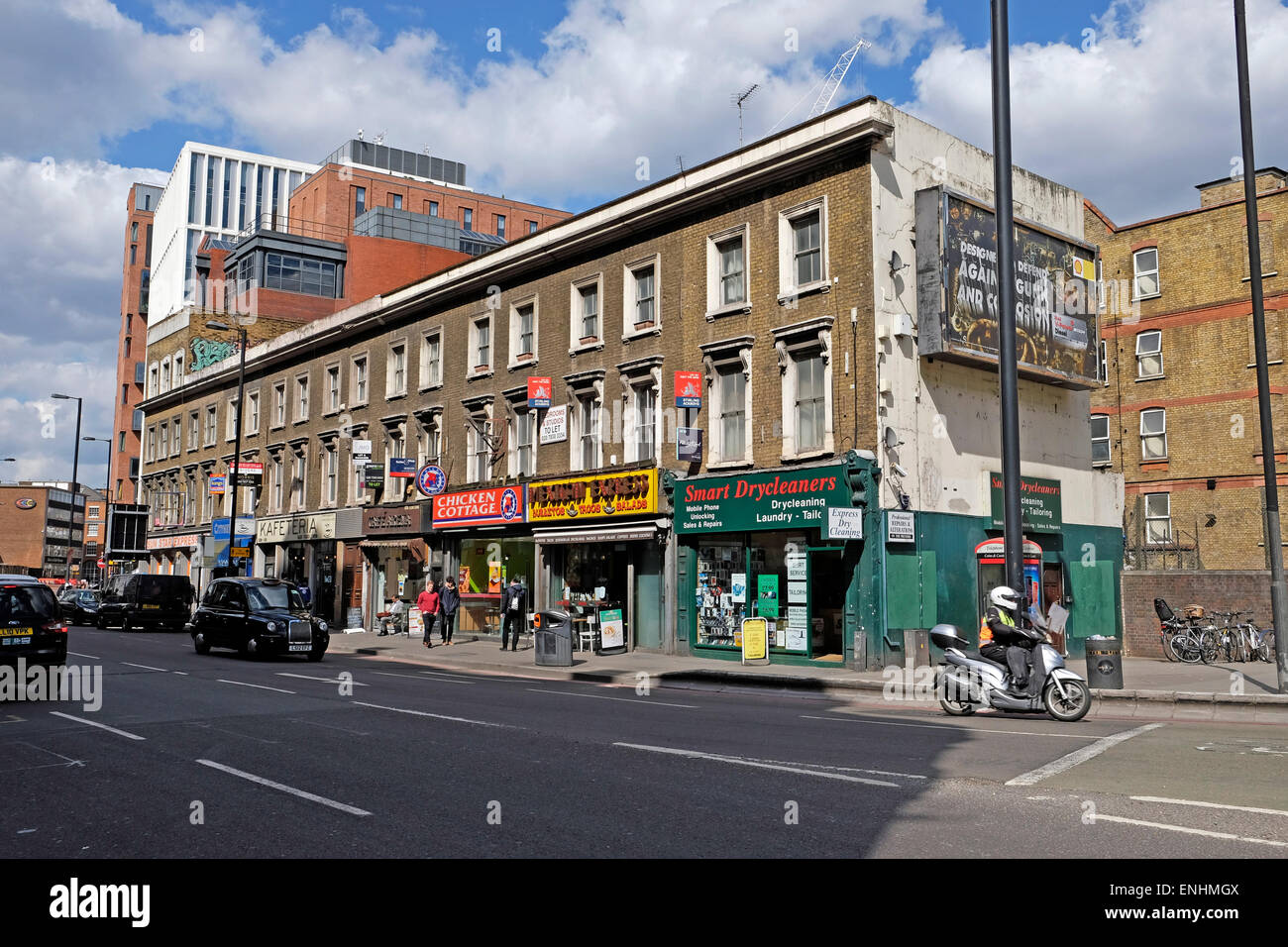 A view of a row terraced shops and flats on City Road at the junction ...