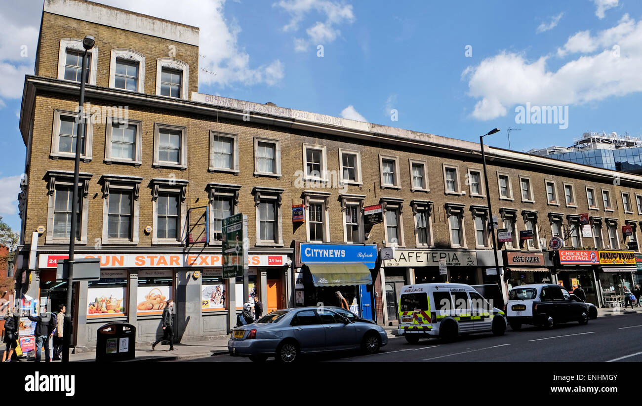 A view of a row terraced shops and flats on City Road near the junction ...