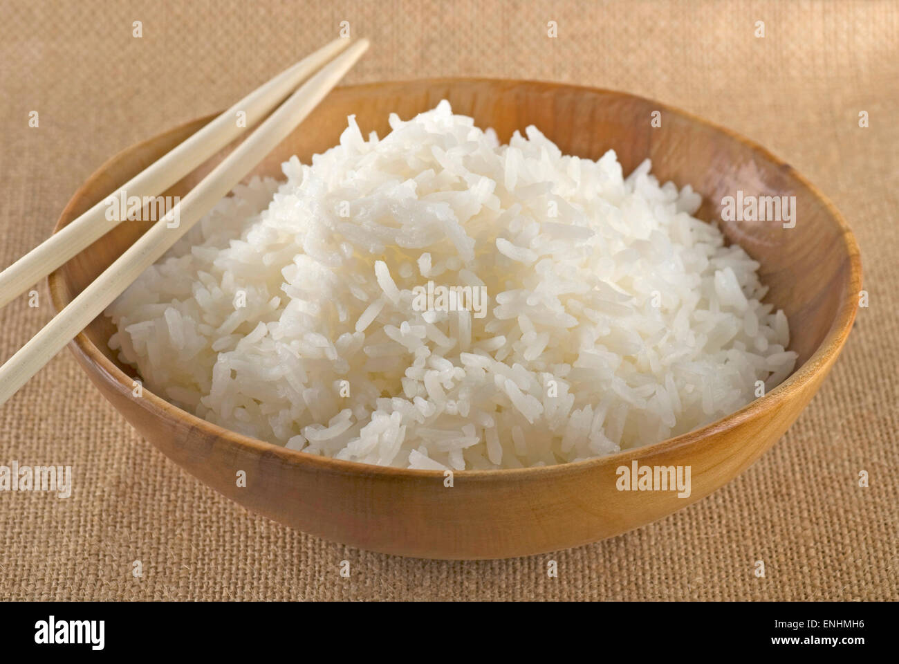 Jasmine rice in a handmade wooden bowl and chopsticks Stock Photo - Alamy