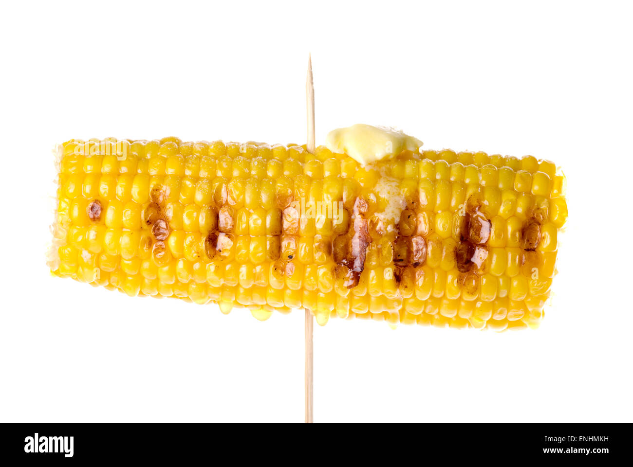 Grilled corn on the cob on a skewer with melted butter and salt Stock ...