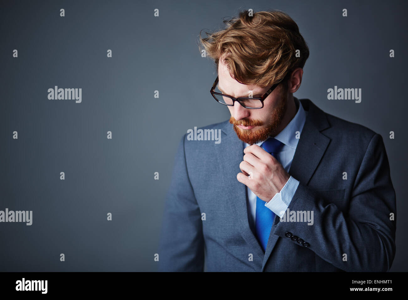 Pensive businessman in elegant suit Stock Photo - Alamy