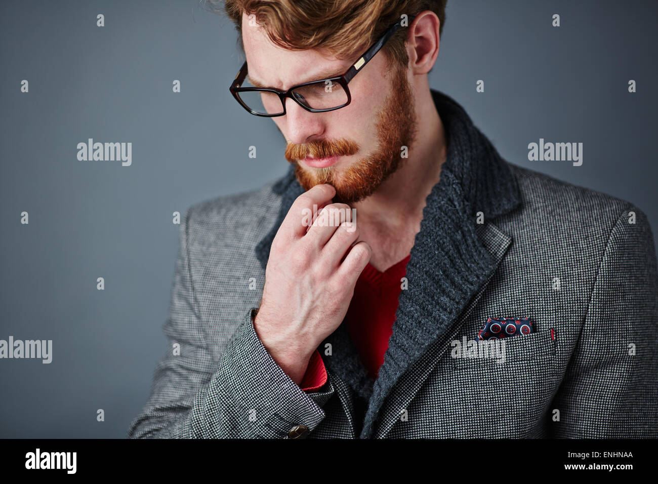 Pensive young man in smart casualwear and eyeglasses Stock Photo - Alamy