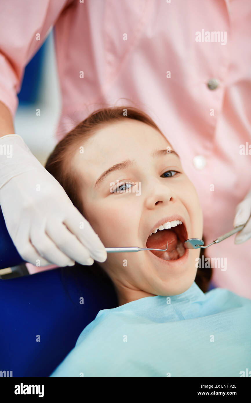 Cute child having mouth checkup Stock Photo - Alamy