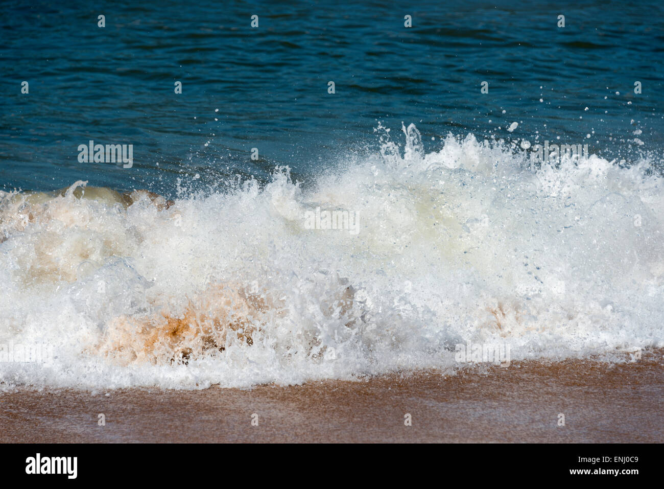 water waves splashing on the beach Stock Photo - Alamy