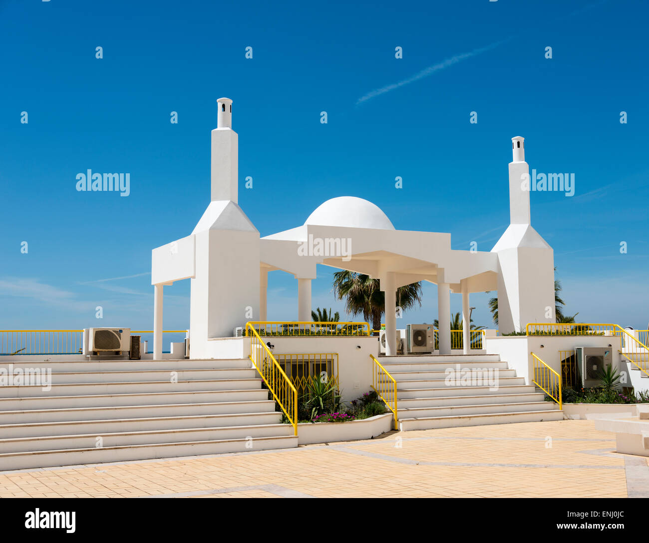 typical portugese style white building on the boulevard of quarteira in ...