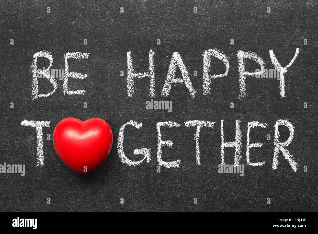 be happy together phrase handwritten on blackboard with heart symbol ...
