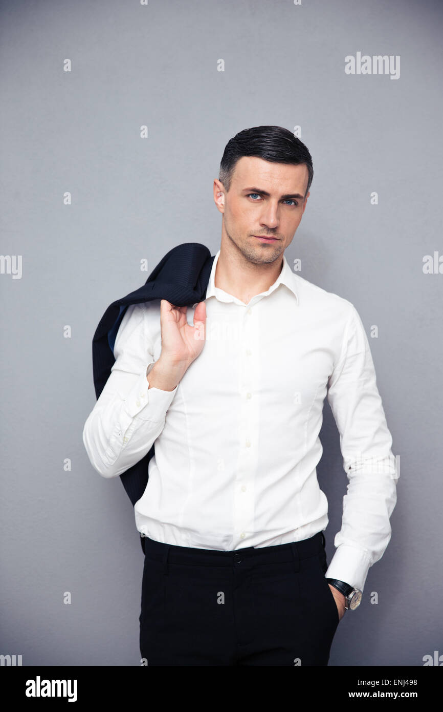 Holding jacket on shoulder hi-res stock photography and images - Alamy
