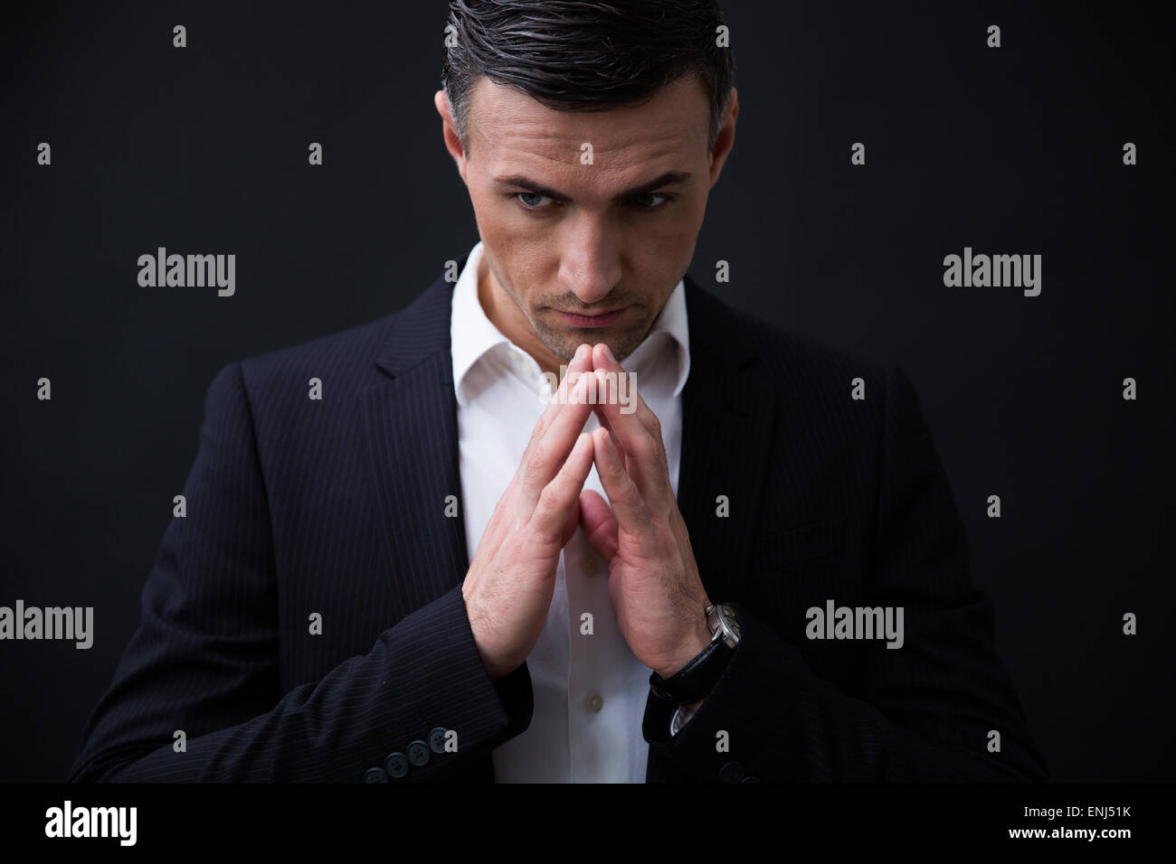 Praying man suit hi-res stock photography and images - Alamy