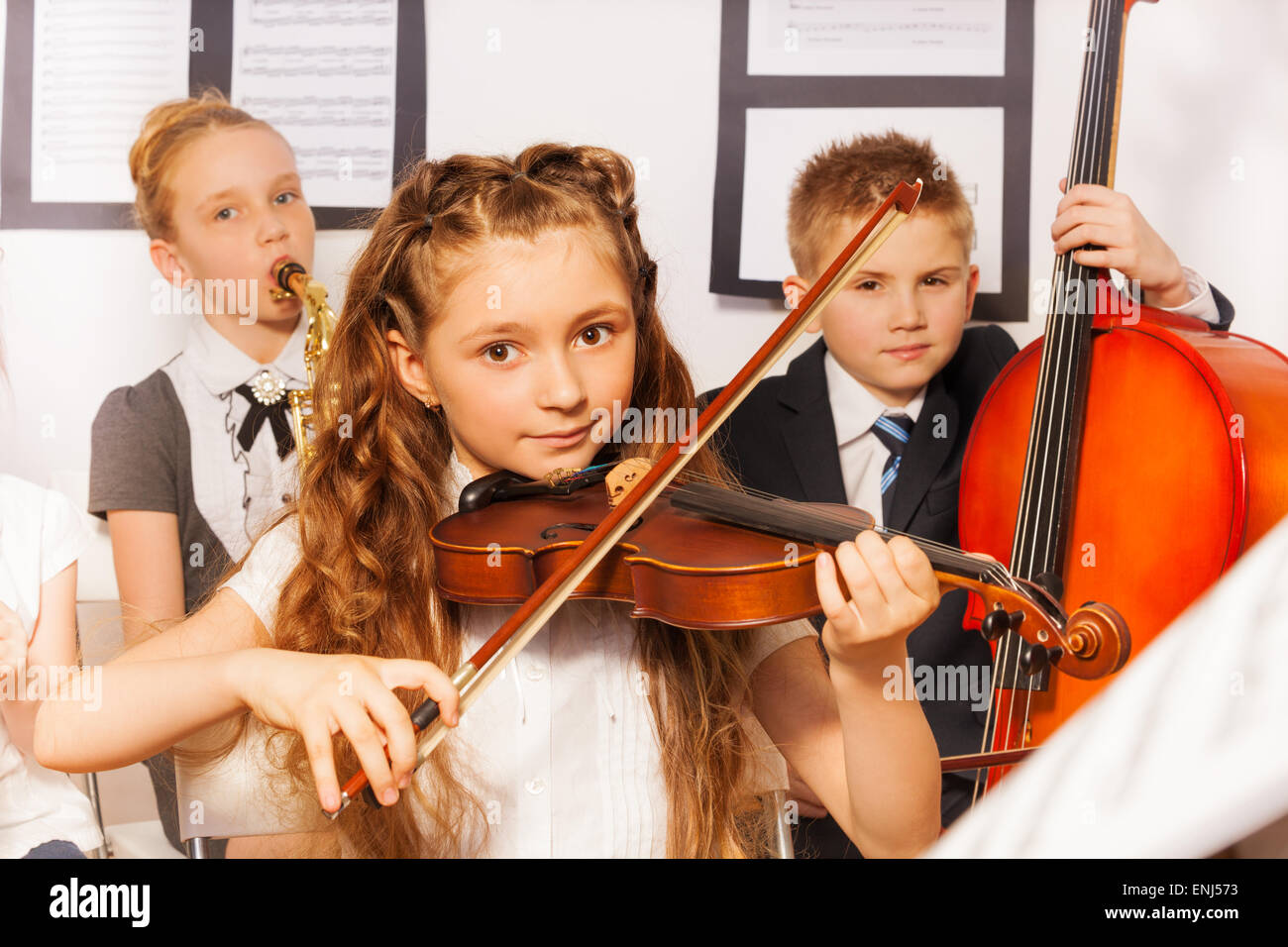 Group of kids playing musical instruments together Stock Photo - Alamy