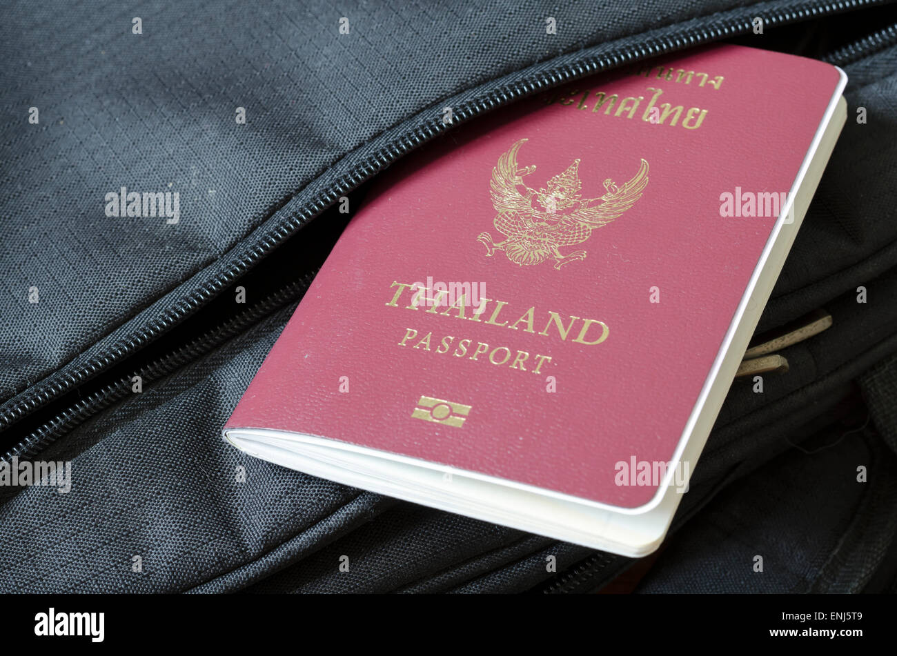 thai passport in black bag Stock Photo - Alamy
