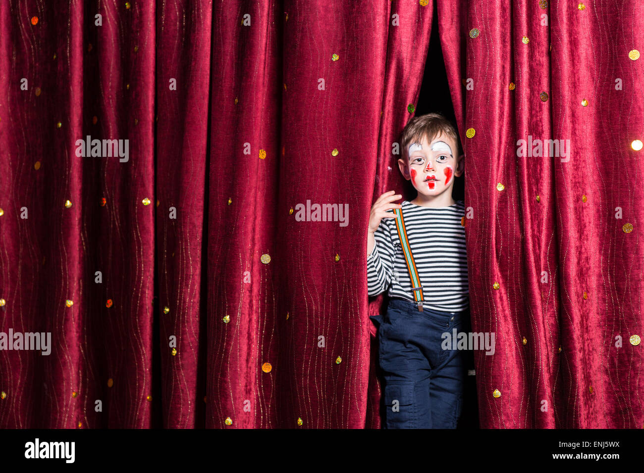 Smiling young boy impatient for his performance in the pantomime to ...