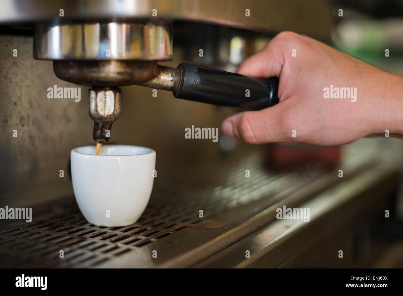 Barista pulling espresso shot-close-up Stock Photo - Alamy