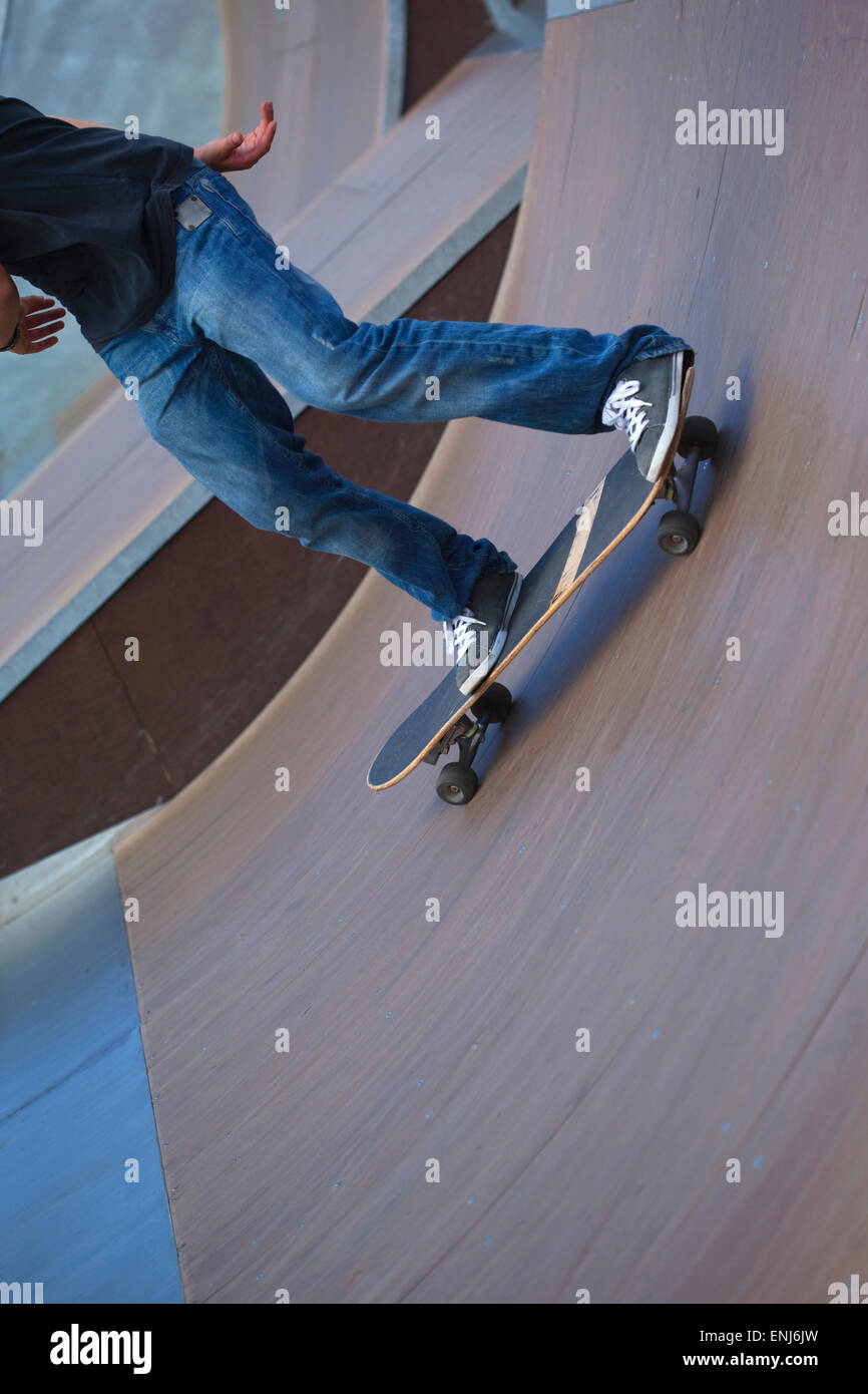 Young skater moving in a skate park Stock Photo - Alamy
