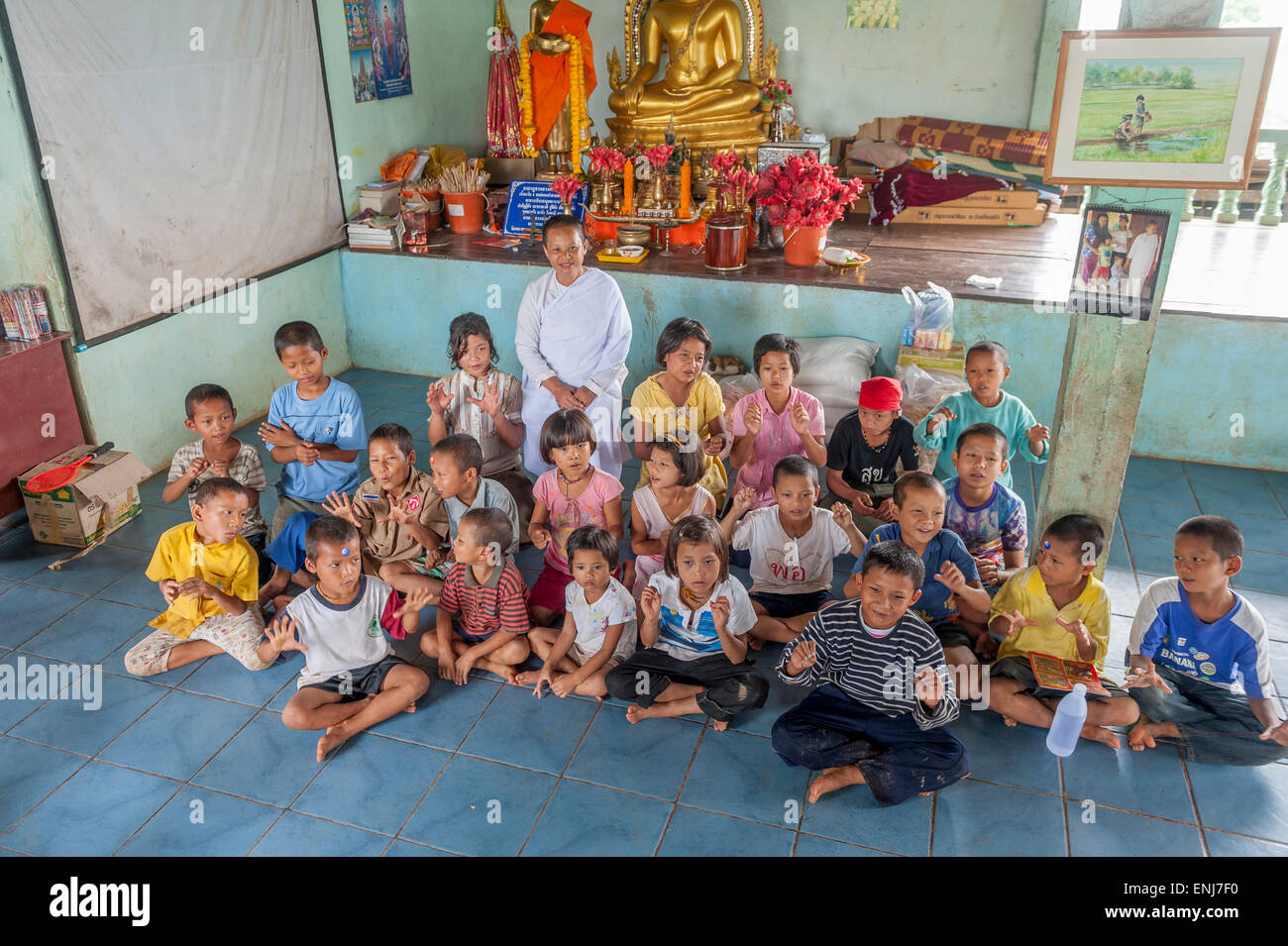 A group of children with Buddhist Nun Pimjai Maneerat at the Orphanage ...