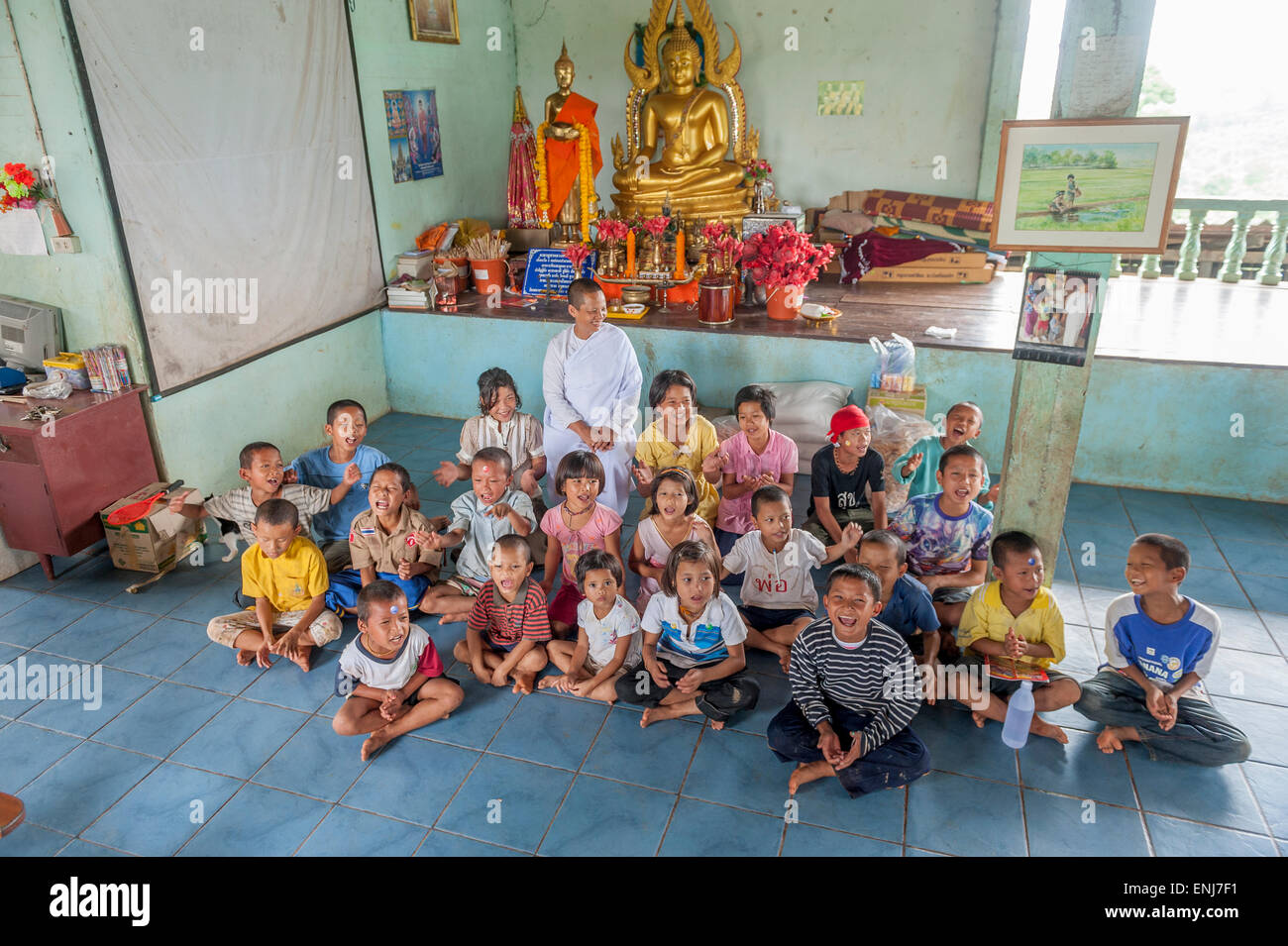 A group of children with Buddhist Nun Pimjai Maneerat at the Orphanage ...