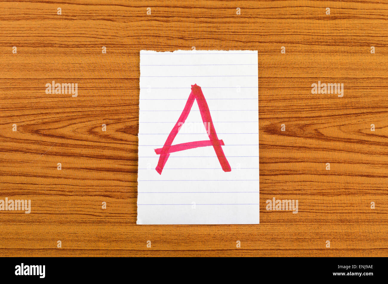 grade a on wood wall background Stock Photo - Alamy