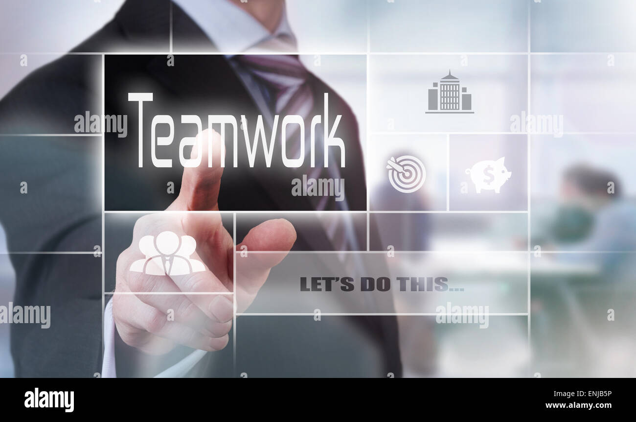 Businessman pressing an Teamwork concept button Stock Photo - Alamy