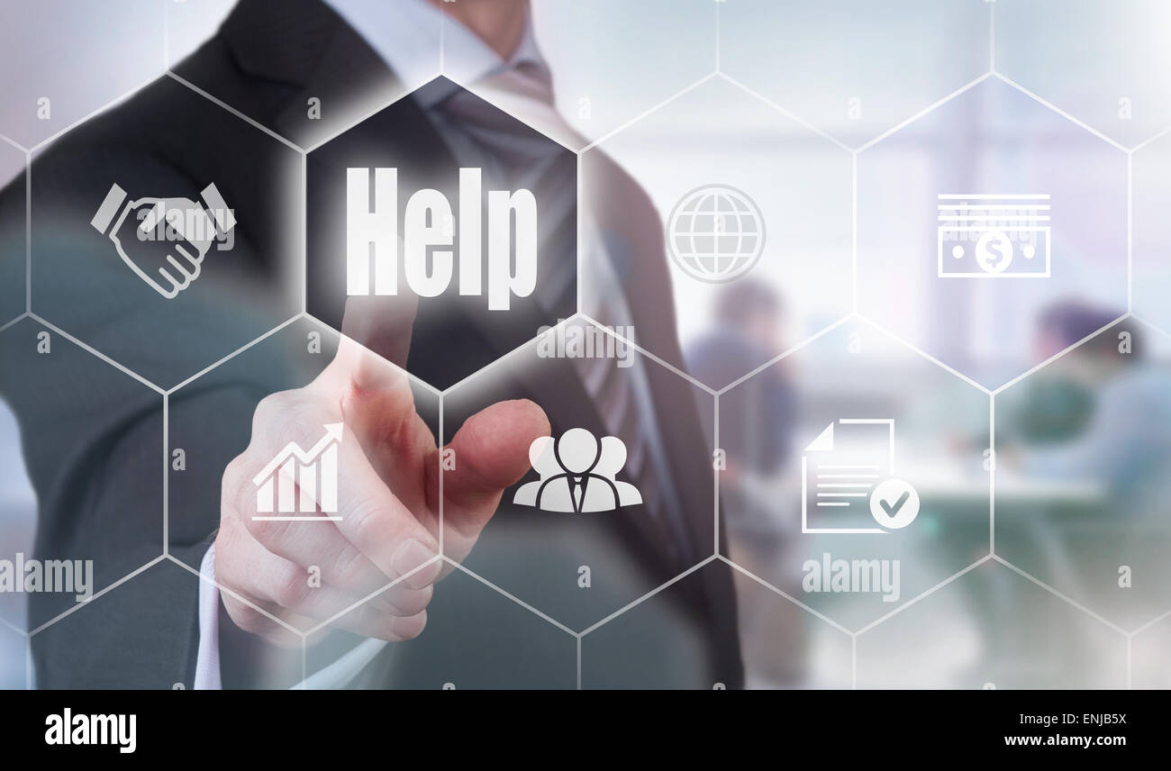 Businessman pressing an Help concept button Stock Photo - Alamy