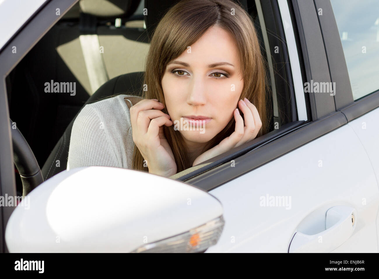 Beauty caucasian girl check up her make-up. Young pretty woman in white ...