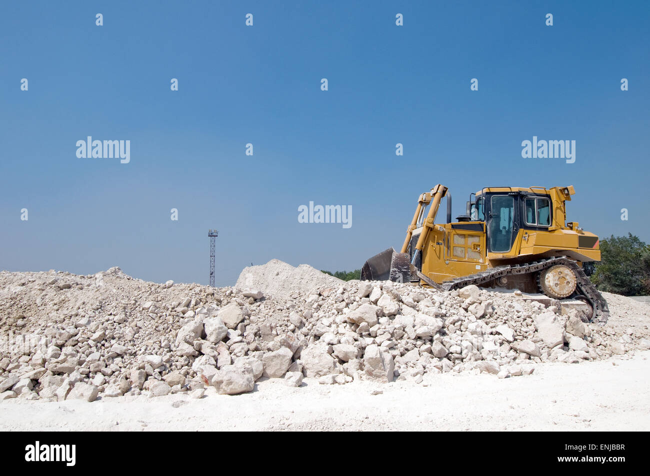 loading machine produces crushed stone for a career Stock Photo - Alamy