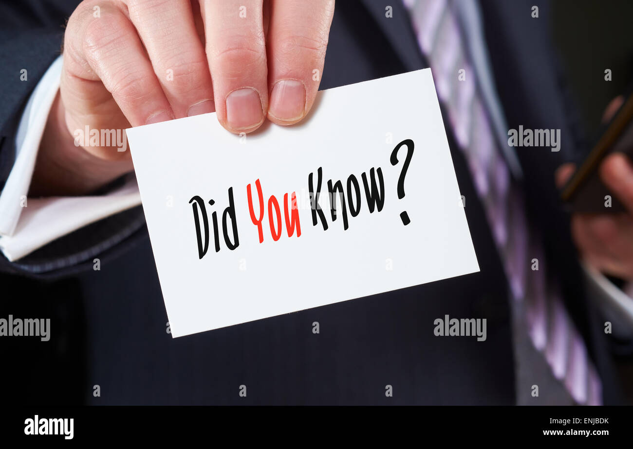 A businessman holding a business card with the words, Did You Know ...