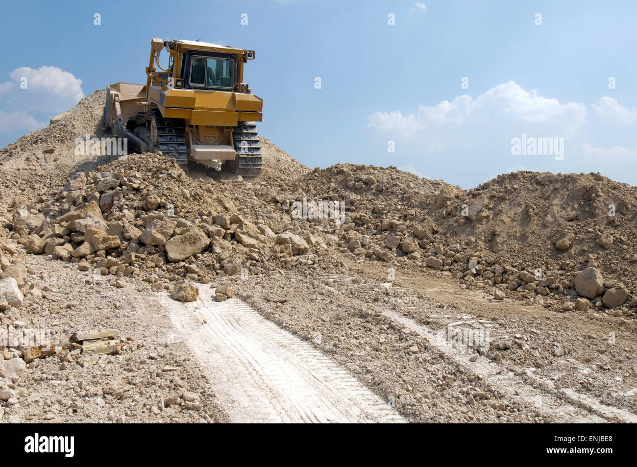 loading machine produces crushed stone for a career Stock Photo - Alamy