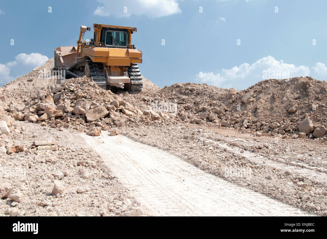 loading machine produces crushed stone for a career Stock Photo - Alamy