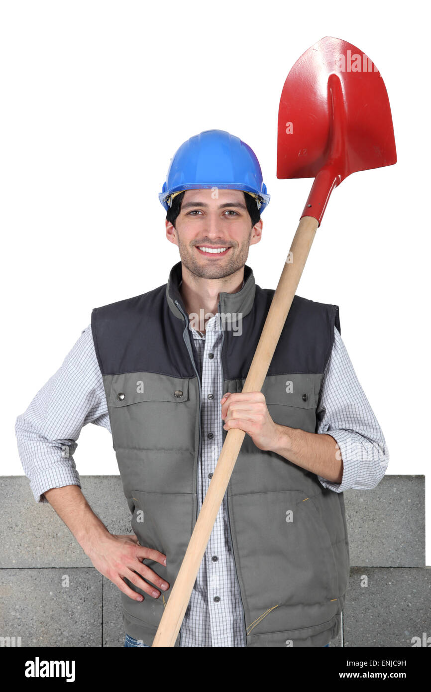 Mason with shovel Stock Photo - Alamy