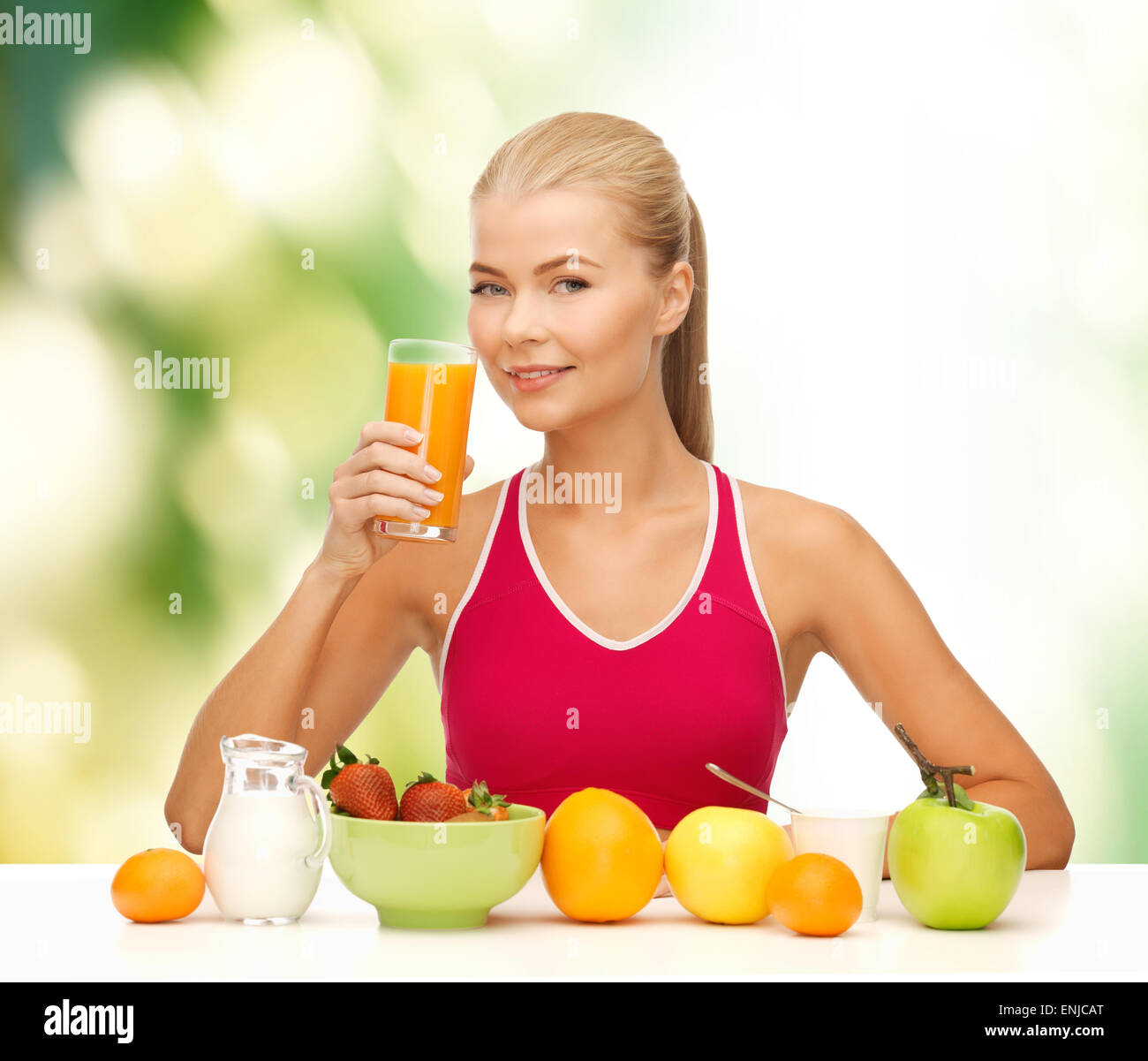 smiling young woman eating healthy breakfast Stock Photo - Alamy