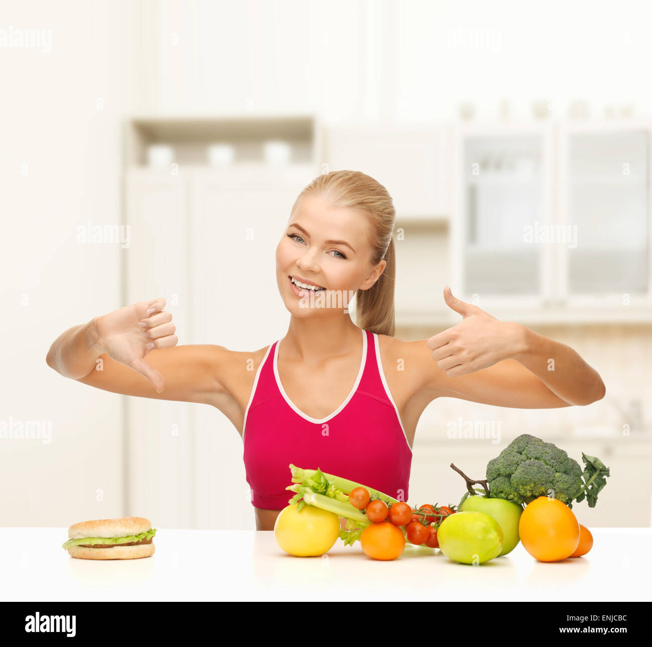 woman with fruits and hamburger comparing food Stock Photo - Alamy